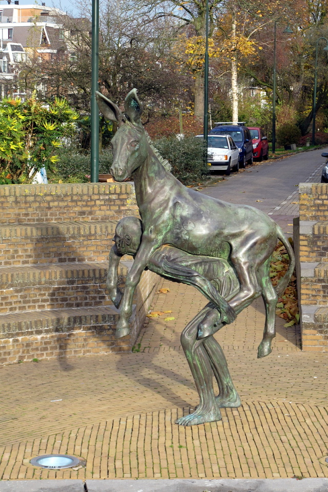 A man carrying a donkey. | Gerda | Blipfoto