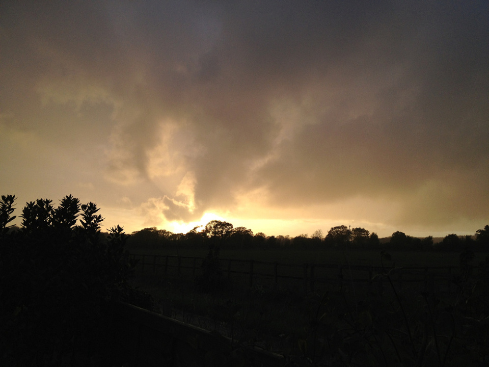 Sun Setting behind the Rain Clouds | What1see | Blipfoto